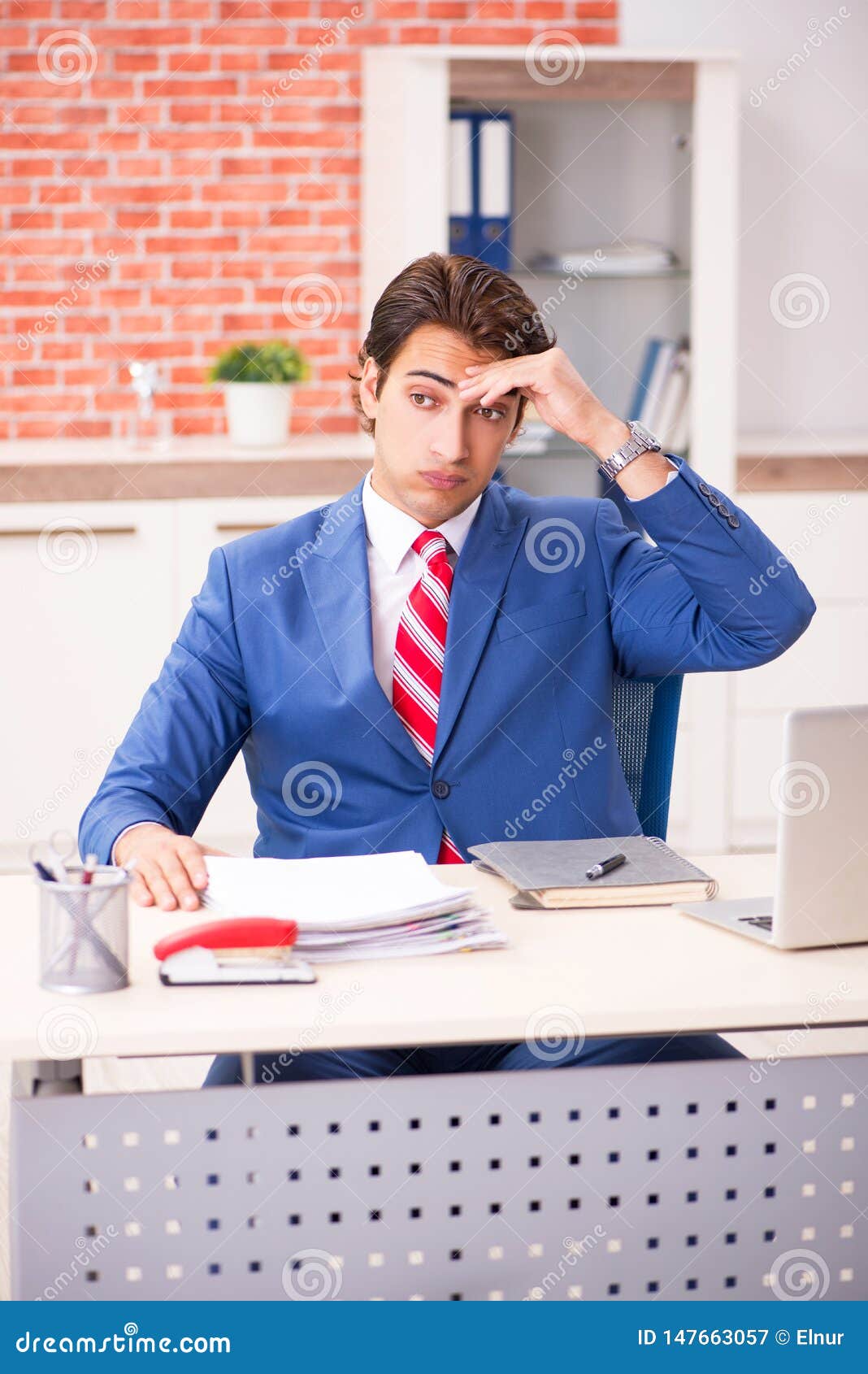 The Young Handsome Employee Working in the Office Stock Image - Image ...