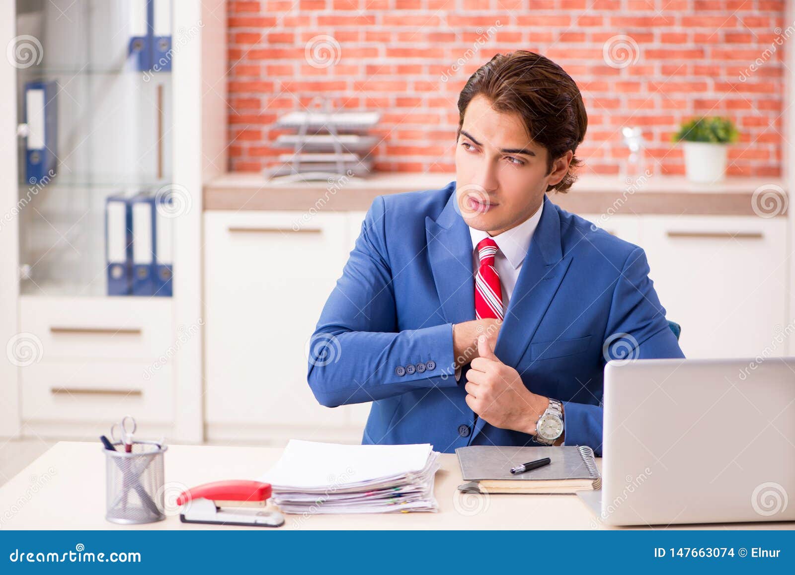The Young Handsome Employee Working in the Office Stock Photo - Image ...