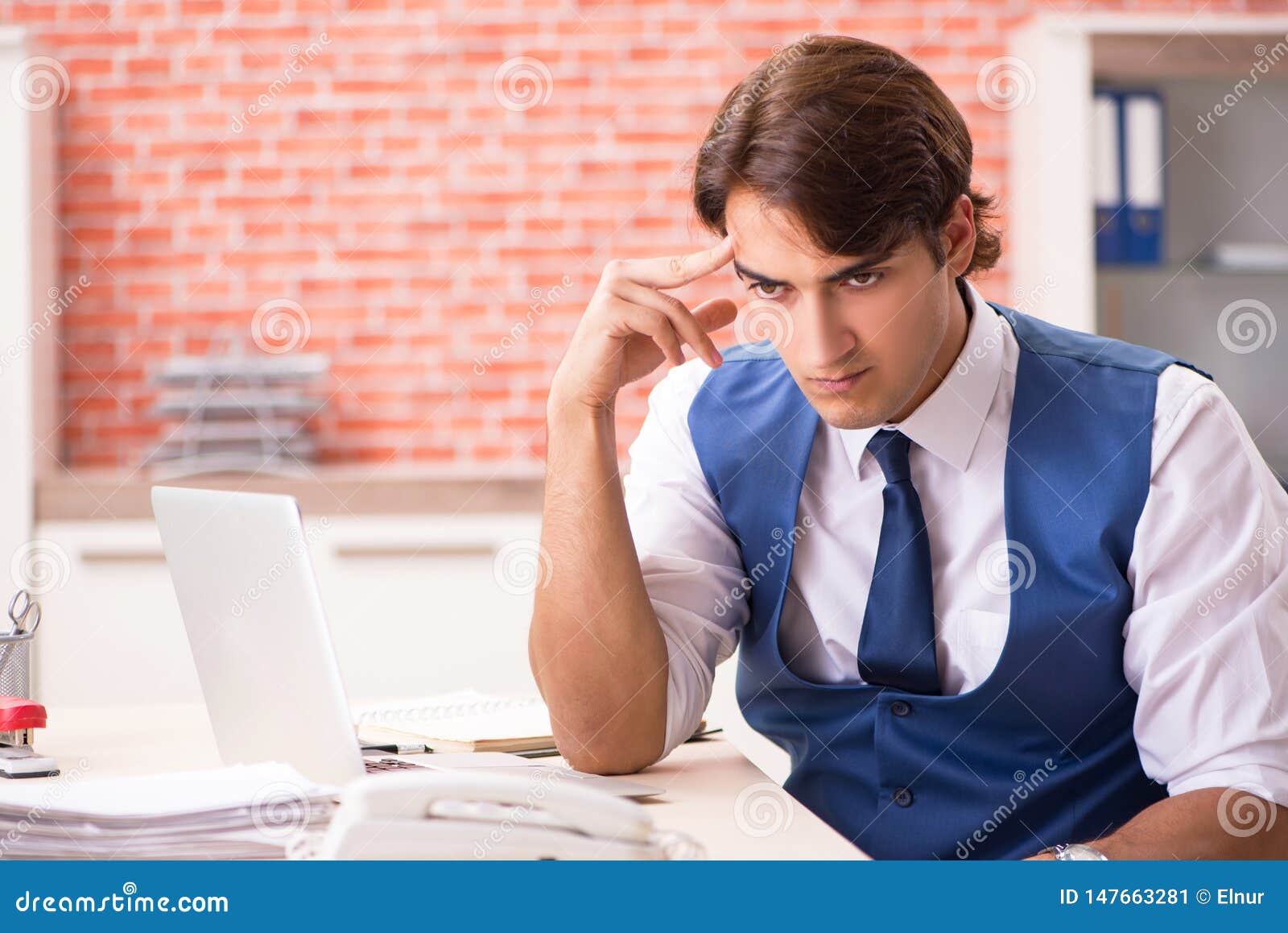 The Young Handsome Employee Working in the Office Stock Image - Image ...