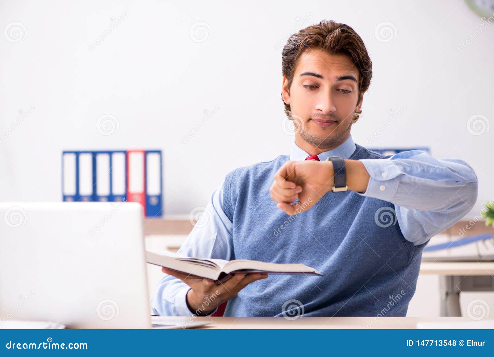 The Young Handsome Employee Working in the Office Stock Photo - Image ...