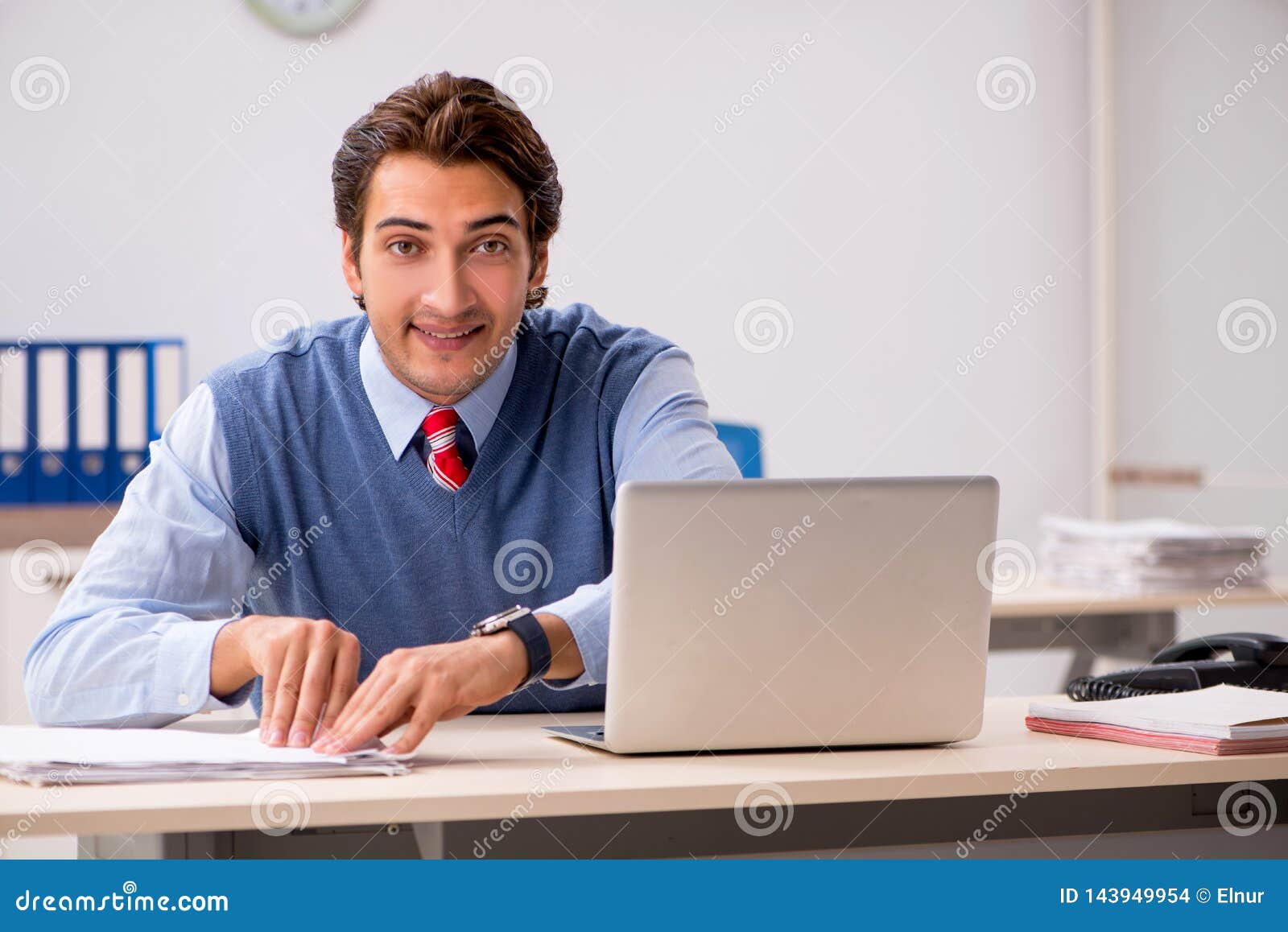 The Young Handsome Employee Working in the Office Stock Photo - Image ...
