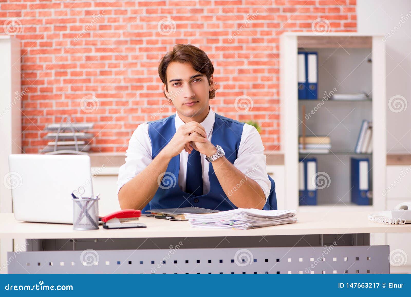 The Young Handsome Employee Working in the Office Stock Image - Image ...