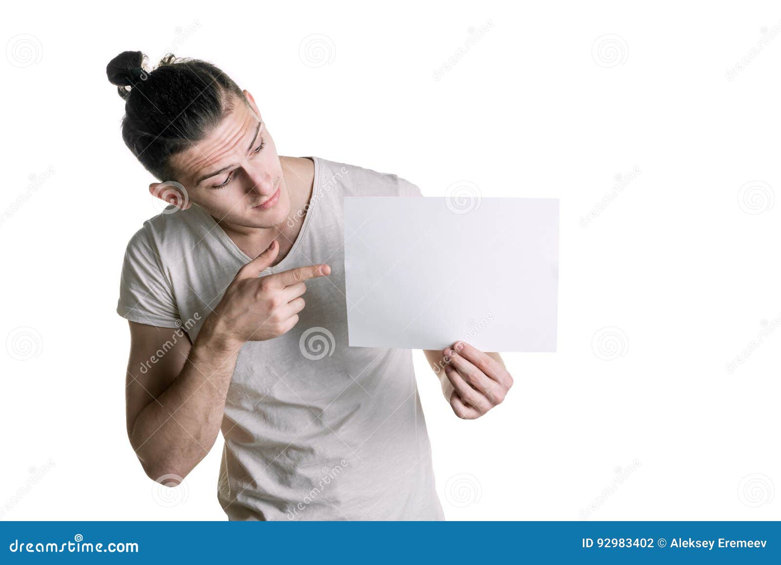 A Young Handsome Guy with a Blank Sheet of Paper Looking at a Sheet ...