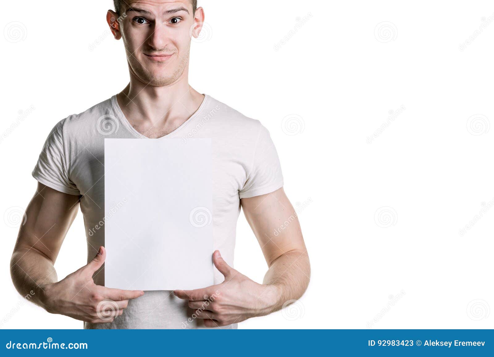 A Young Handsome Guy with a Blank Sheet of Paper Looking at a Sheet ...