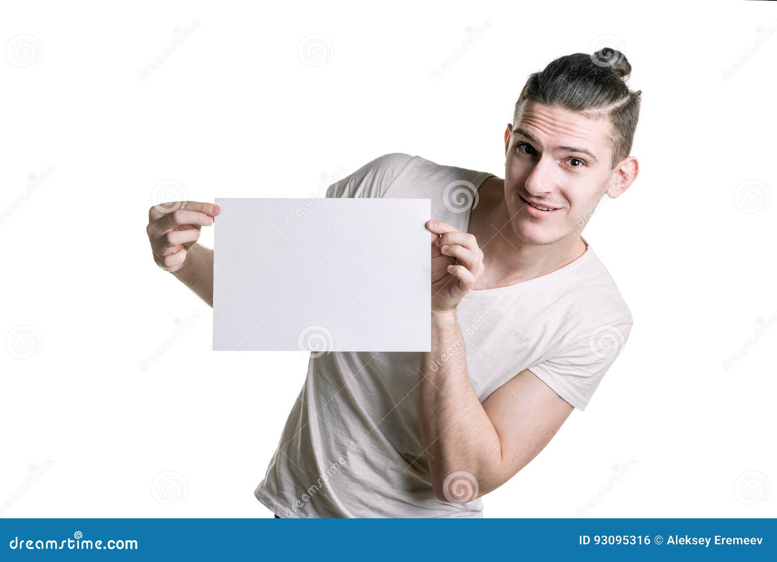A Young Handsome Guy with a Blank Sheet of Paper Looking at a Sheet ...