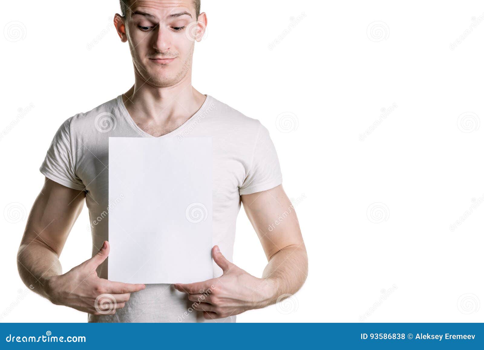 A Young Handsome Guy with a Blank Sheet of Paper Looking at a Sheet ...