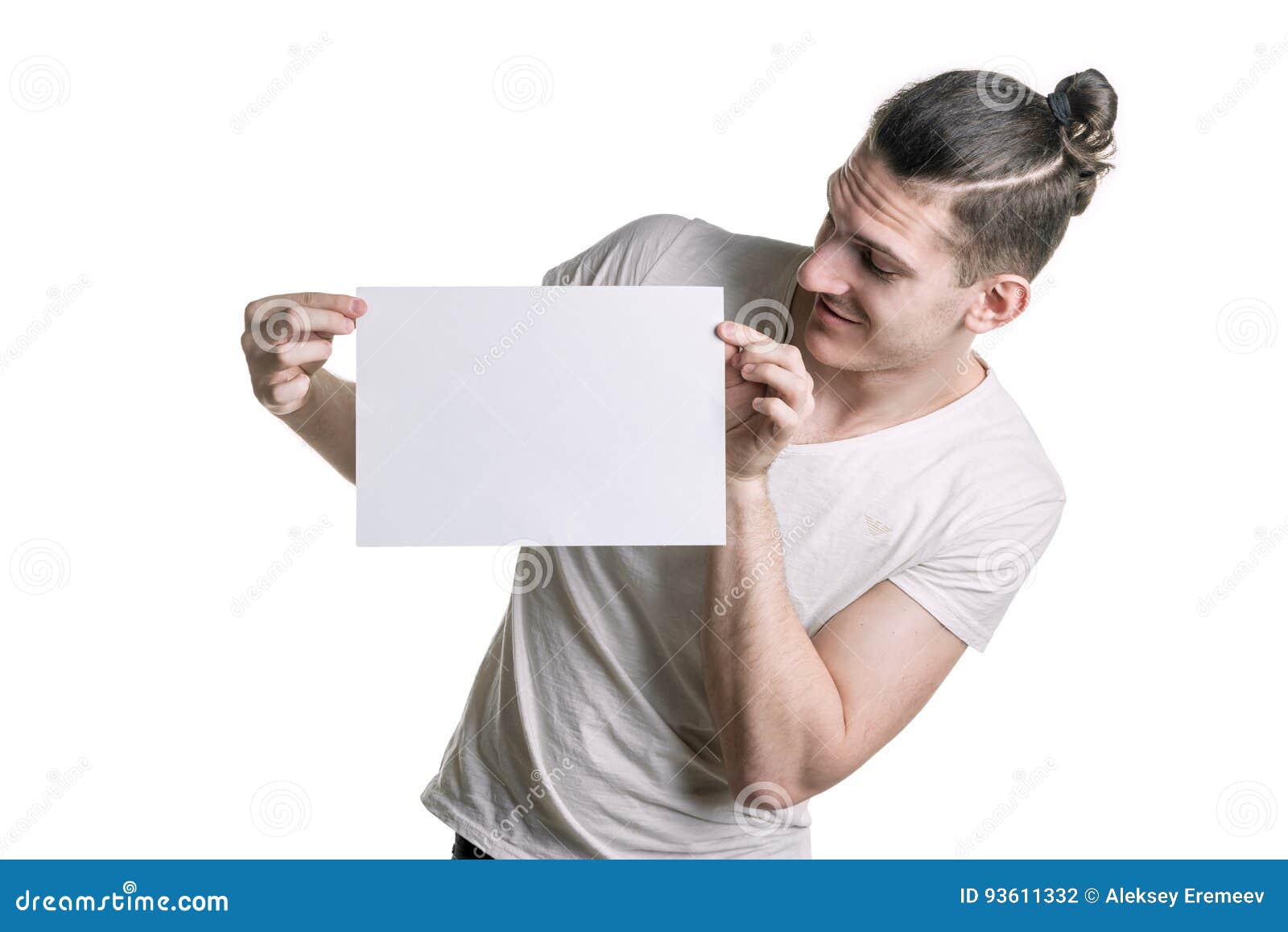 A Young Handsome Guy with a Blank Sheet of Paper Looking at a Sheet ...