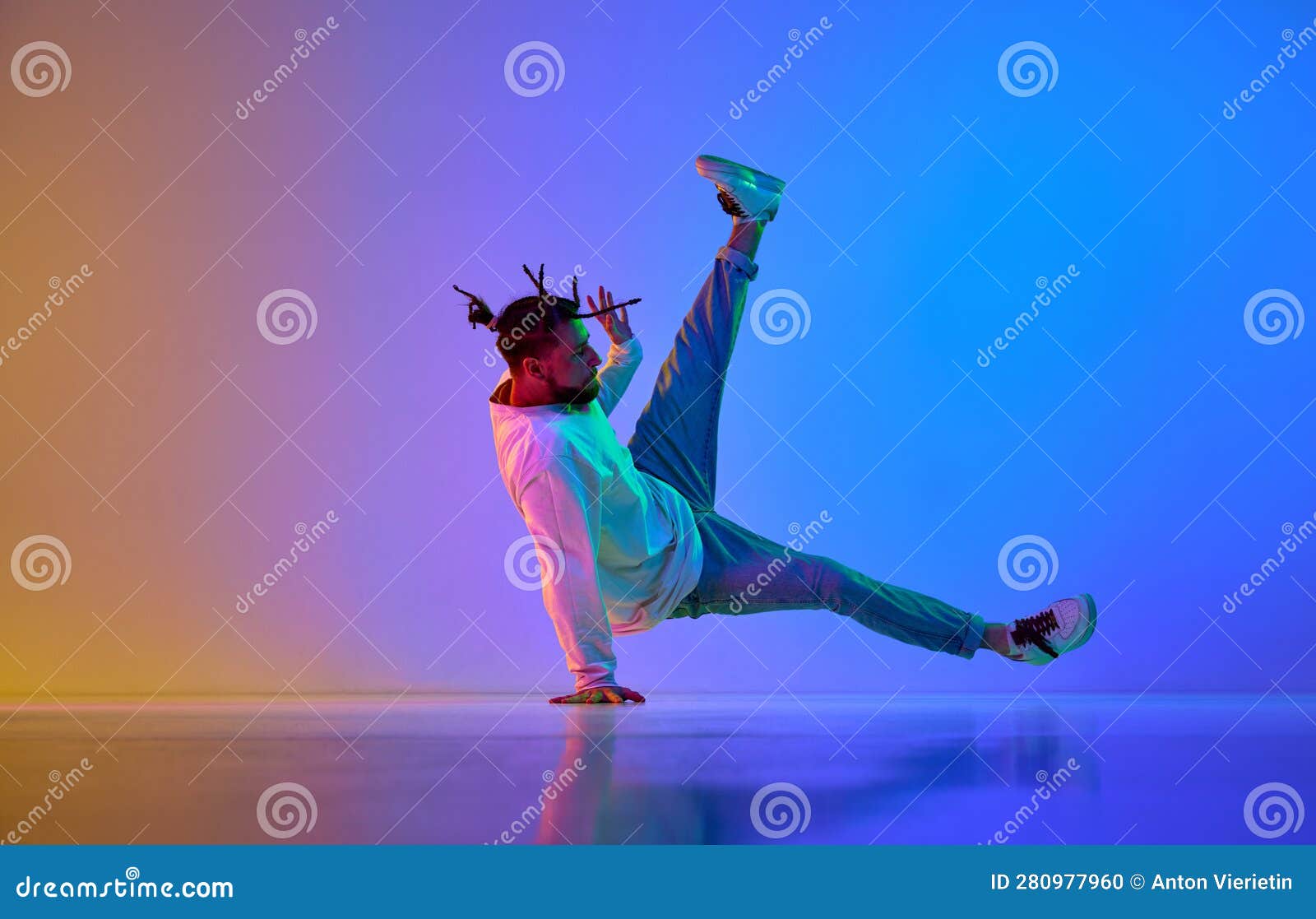 Young Handsome Guy in Casual Clothes and Dreads Dancing Breakdance ...