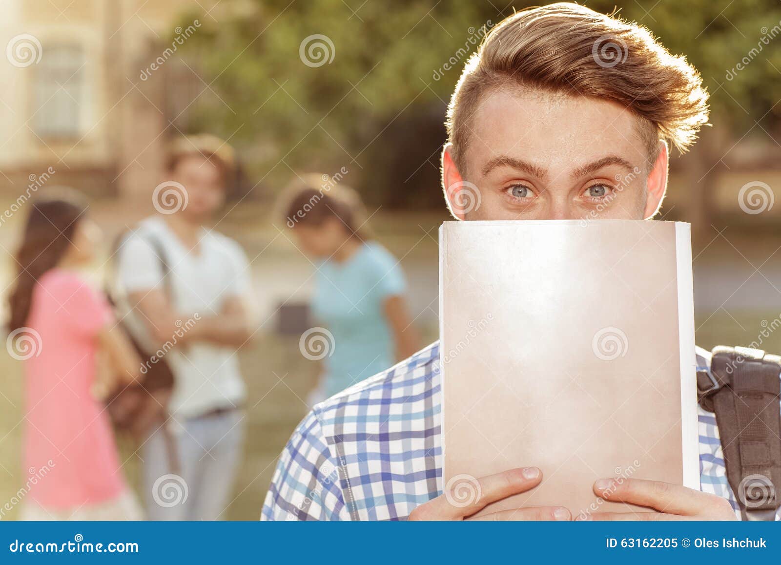 Young Handsome Guy Holding a Notebook Stock Image - Image of people ...