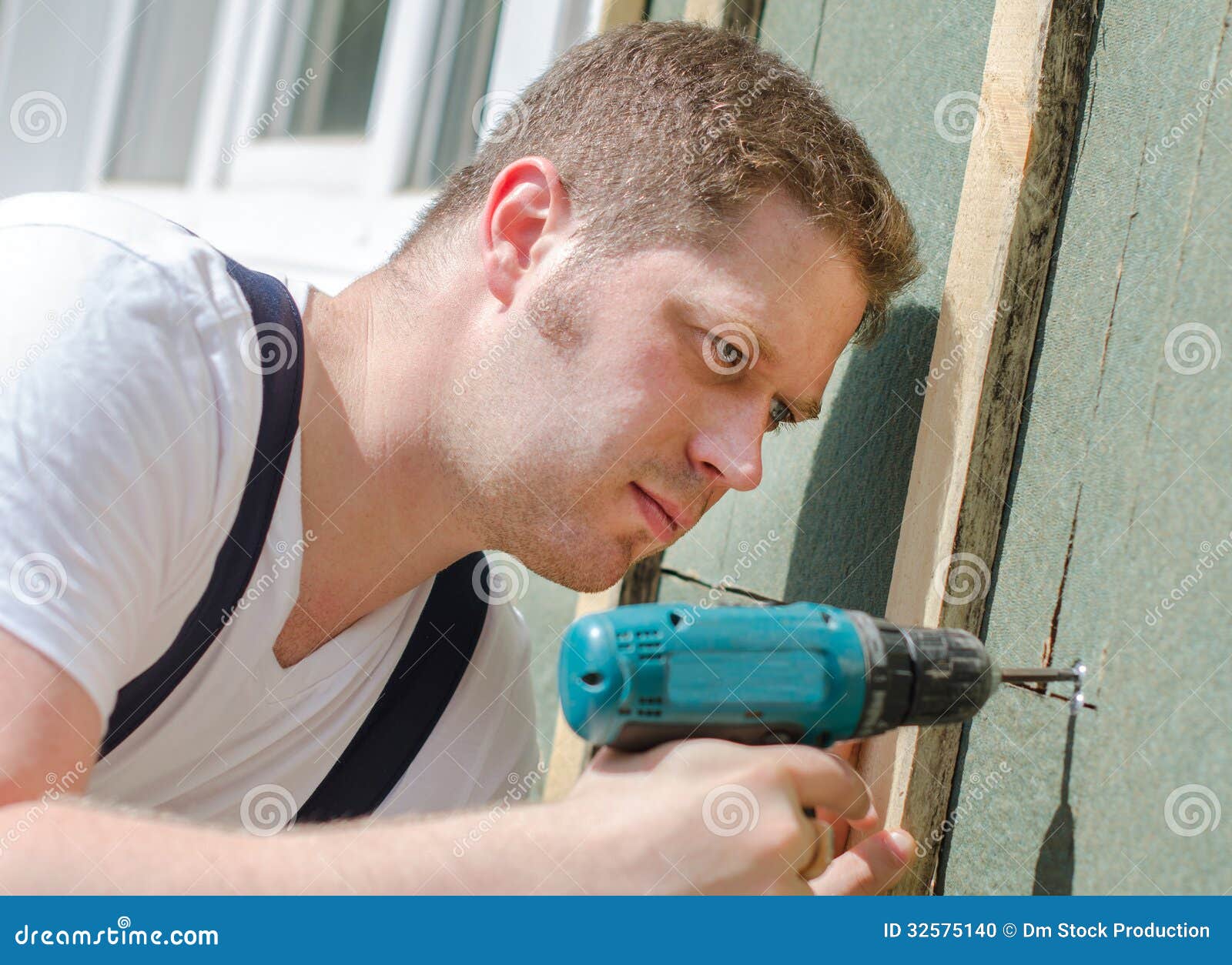 Young handsome handyman stock photo. Image of machine - 32575140