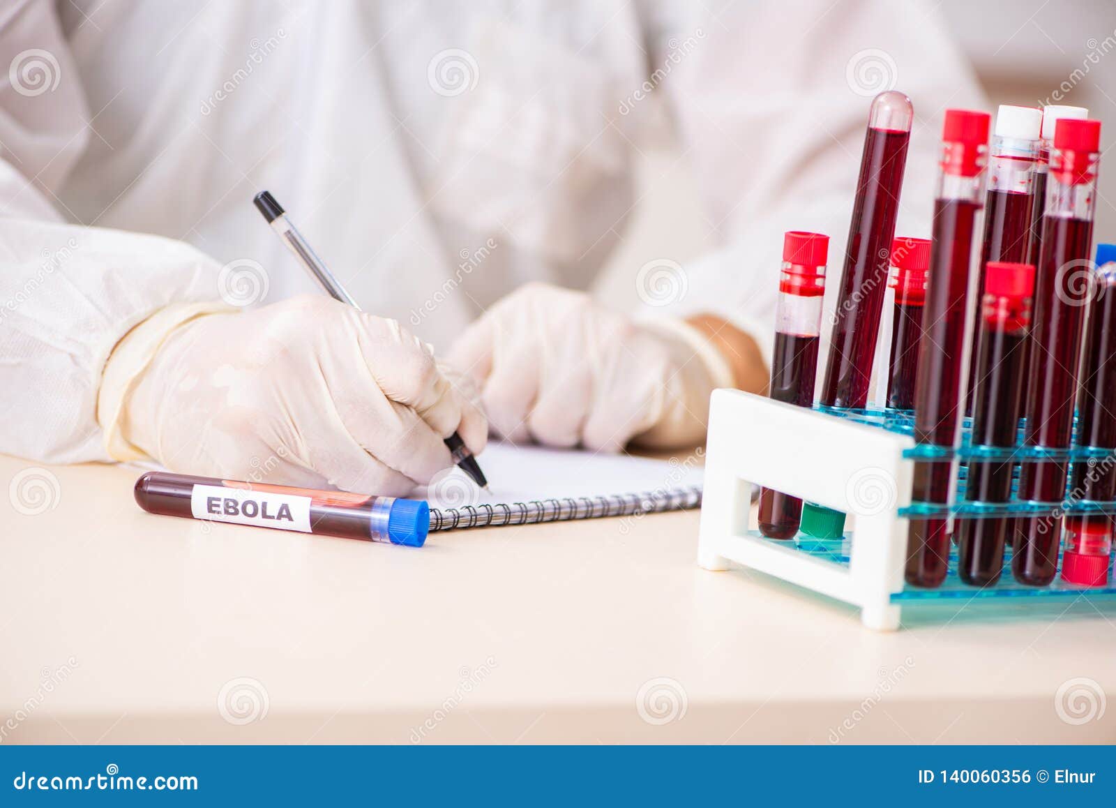 The Young Handsome Lab Assistant Testing Blood Samples in Hospital ...