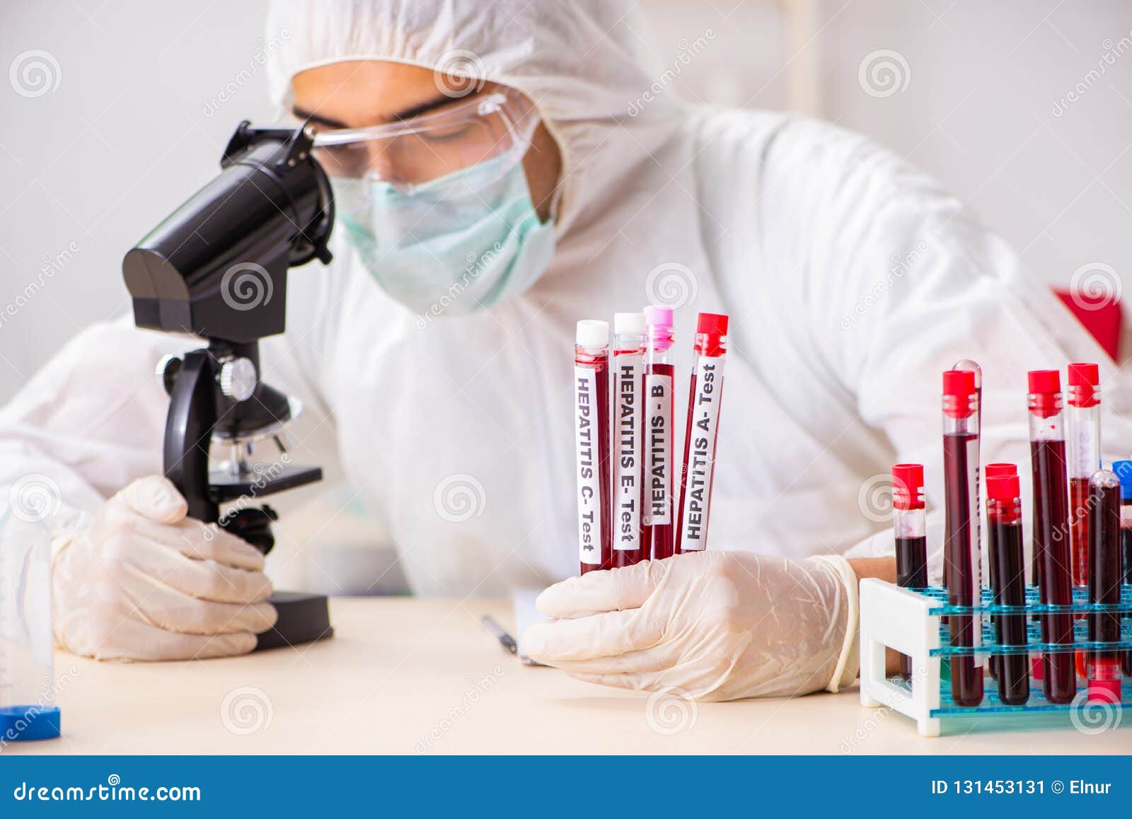 The Young Handsome Lab Assistant Testing Blood Samples in Hospital ...