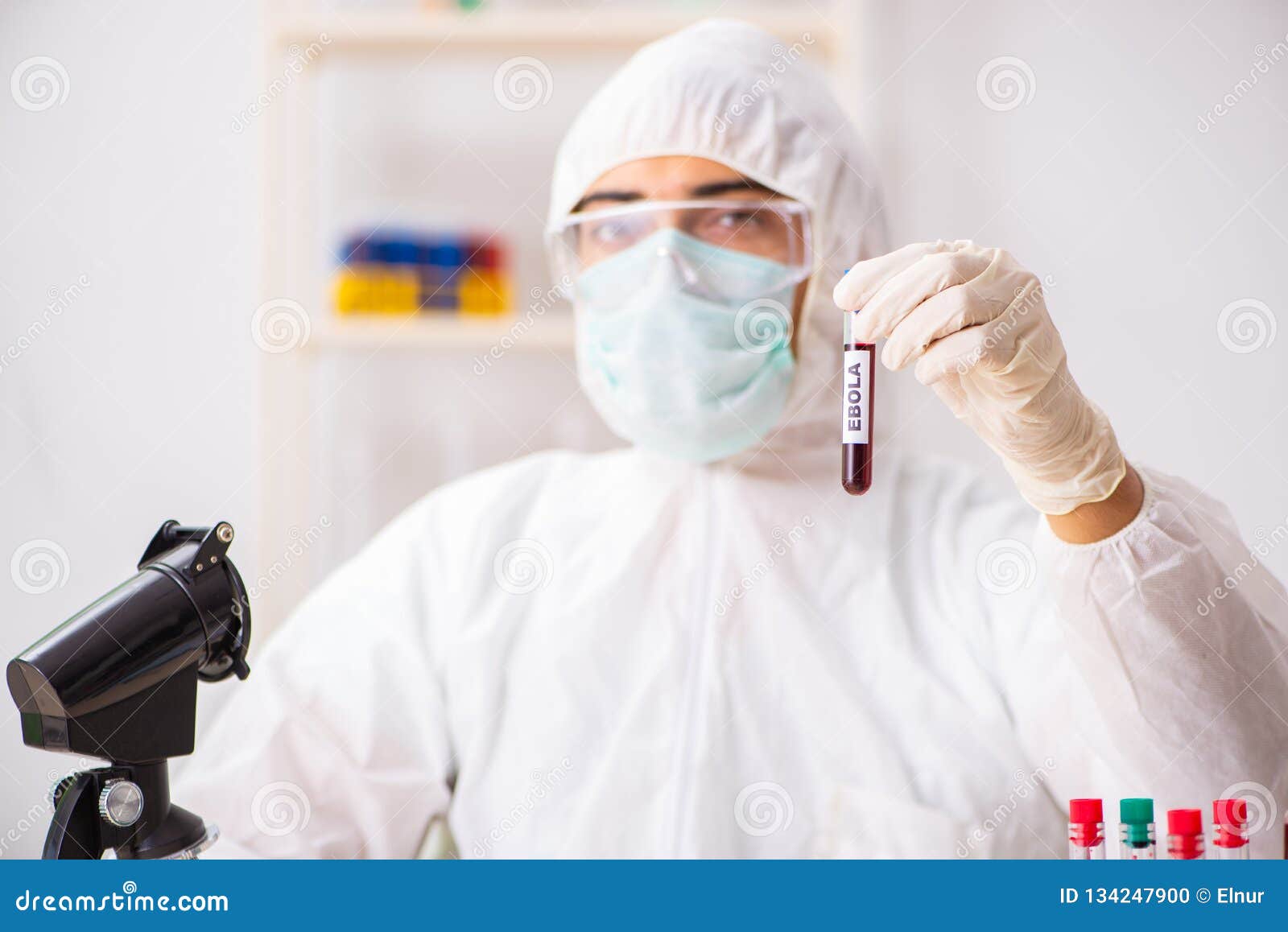 The Young Handsome Lab Assistant Testing Blood Samples in Hospital ...