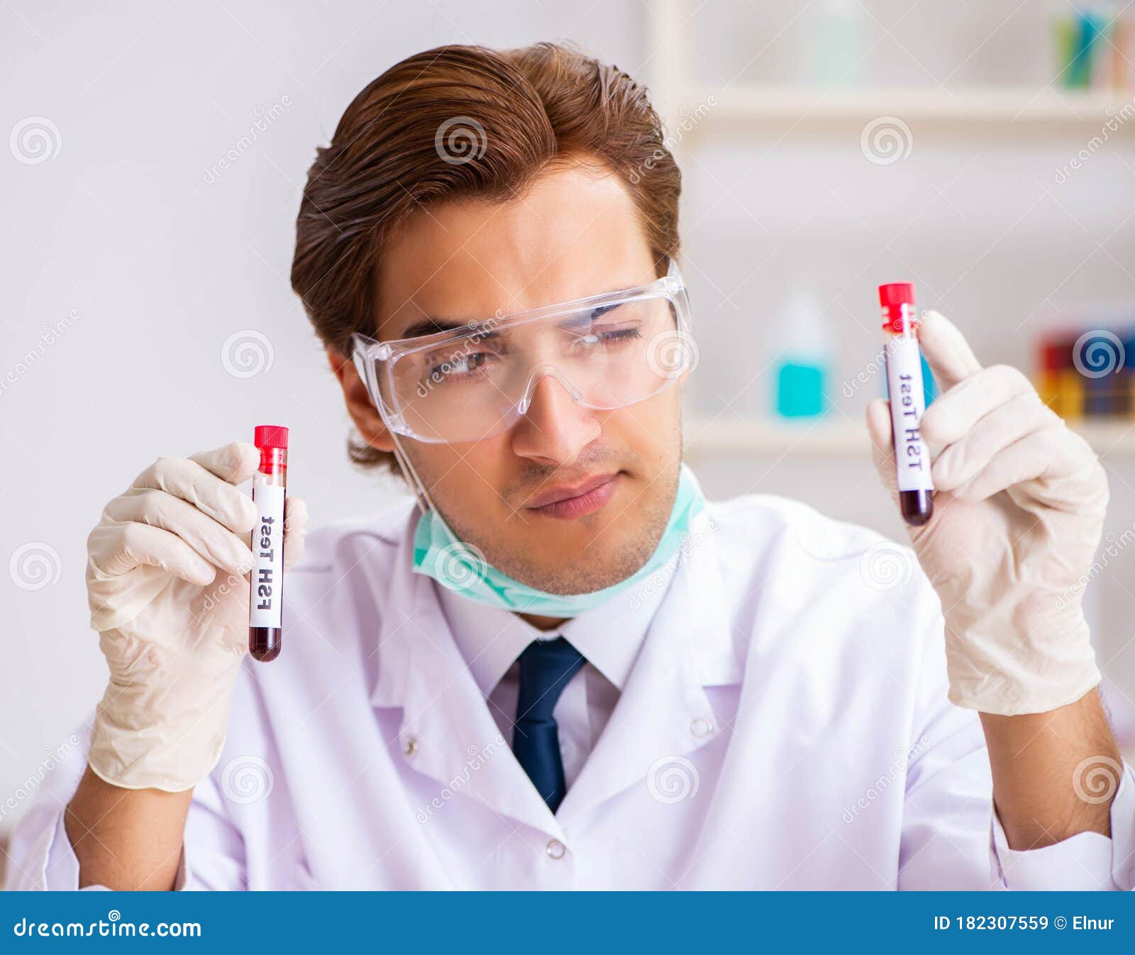 Young Handsome Lab Assistant Testing Blood Samples in Hospital Stock ...