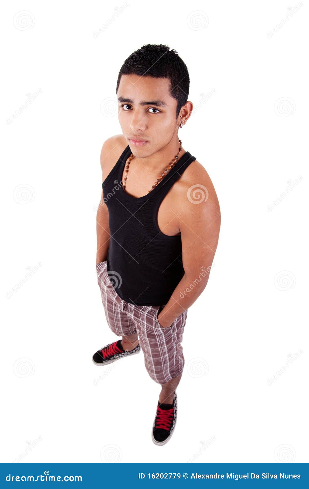 Handsome Latin Young Man Wearing Backpack And Vest Royalty-Free Stock ...