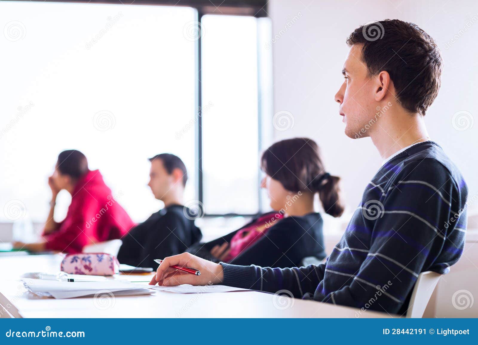 Young, Handsome Male College Student Sitting in a Classroom Stock Image ...