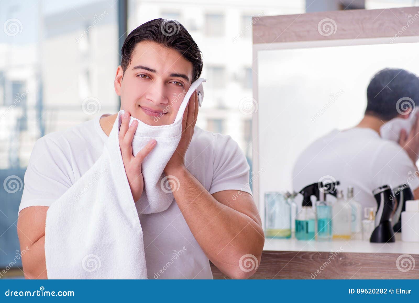 The Young Handsome Man Applying Face Cream Stock Photo - Image of ...