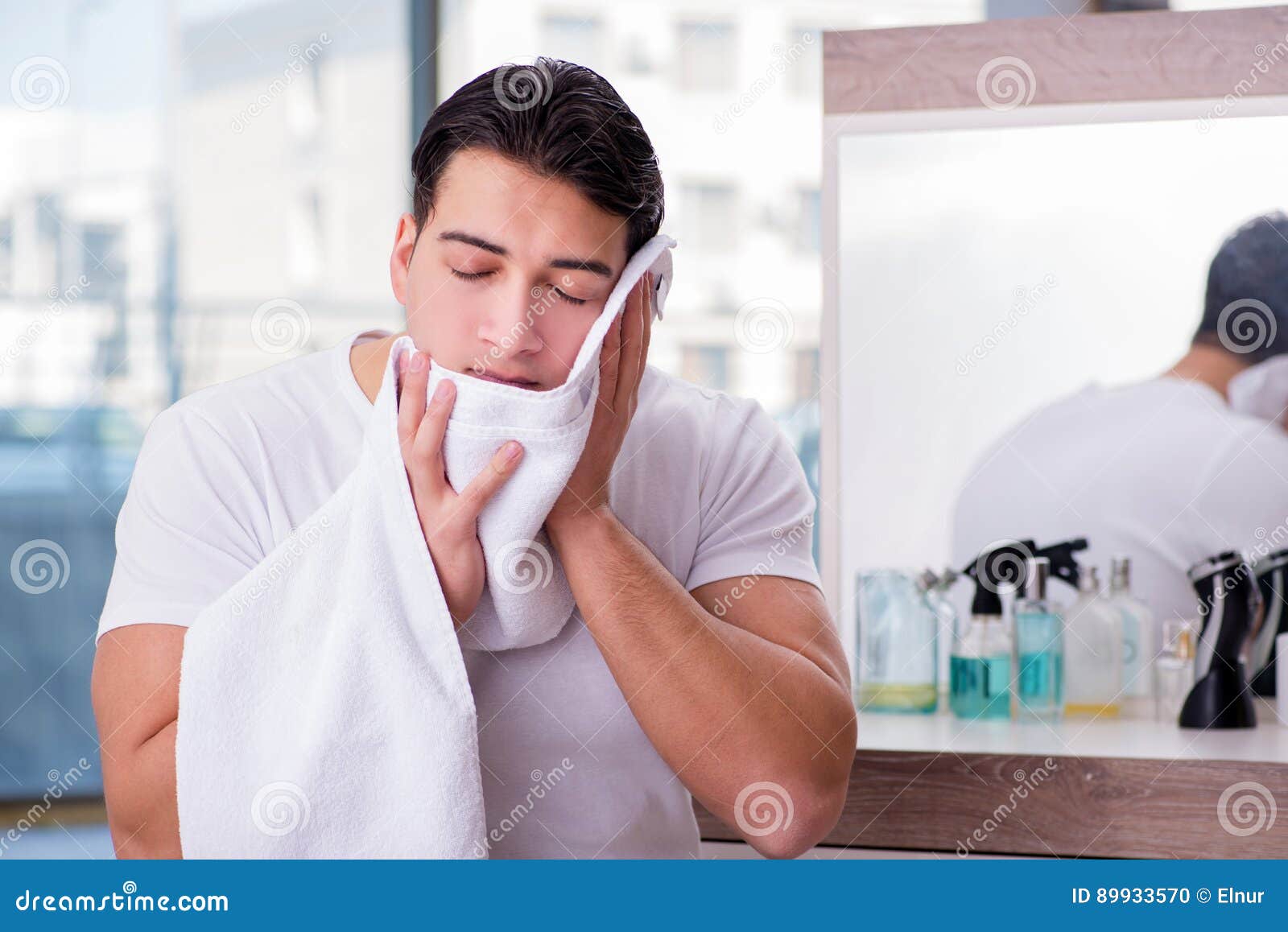 The Young Handsome Man Applying Face Cream Stock Photo - Image of cream ...