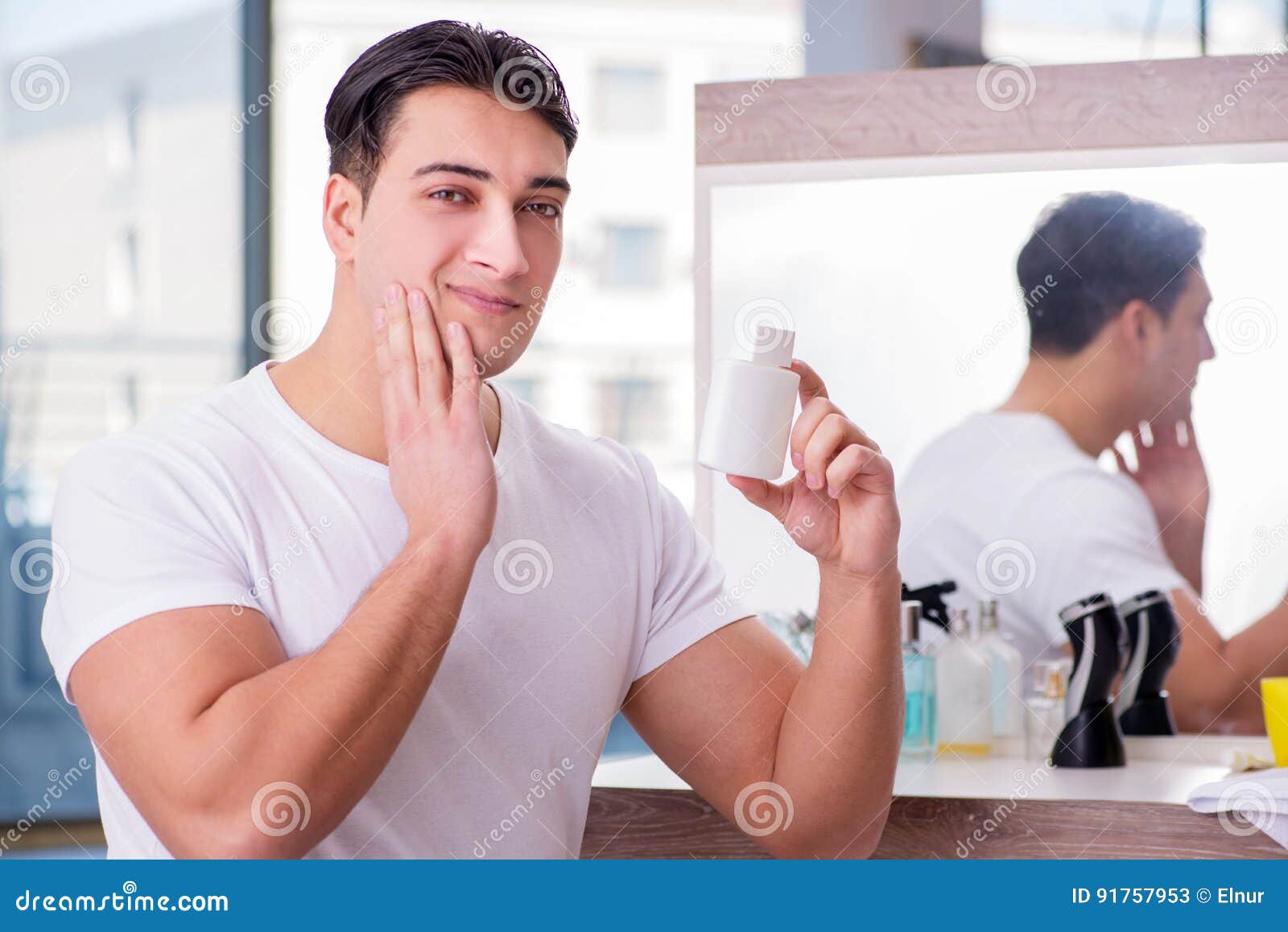 The Young Handsome Man Applying Face Cream Stock Image - Image of happy ...