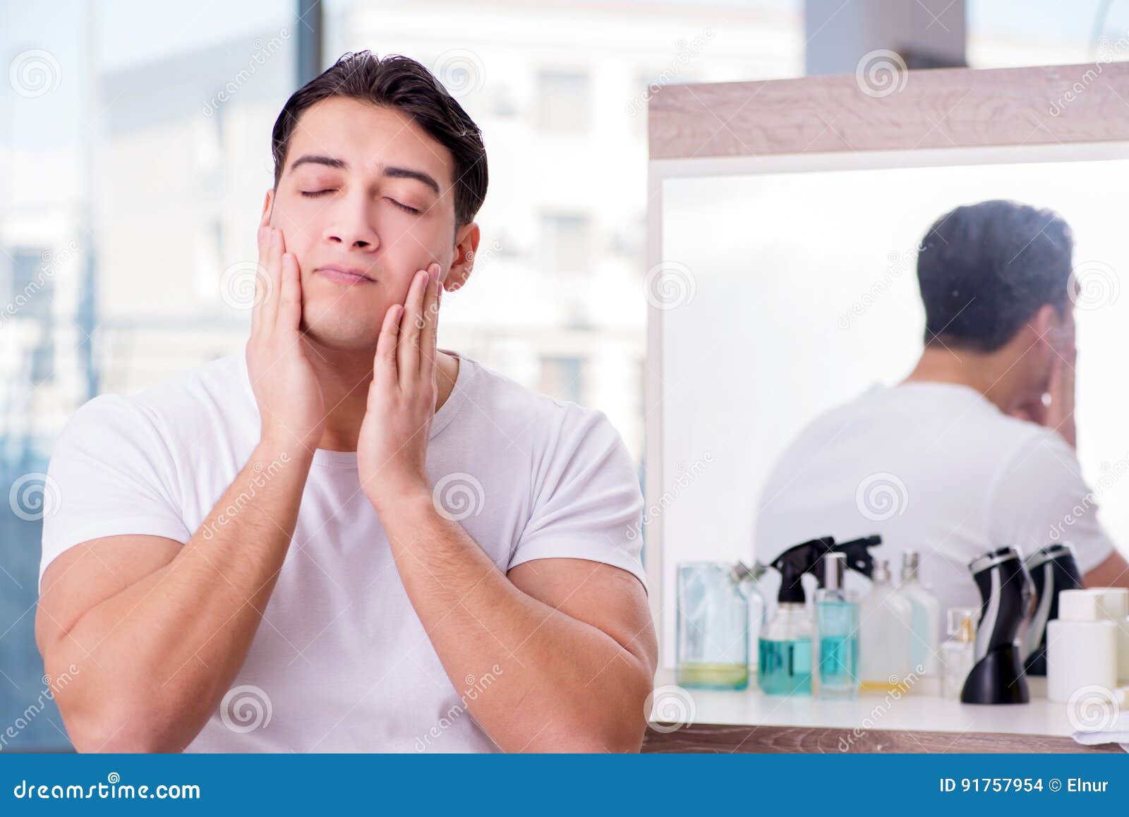 The Young Handsome Man Applying Face Cream Stock Photo - Image of ...