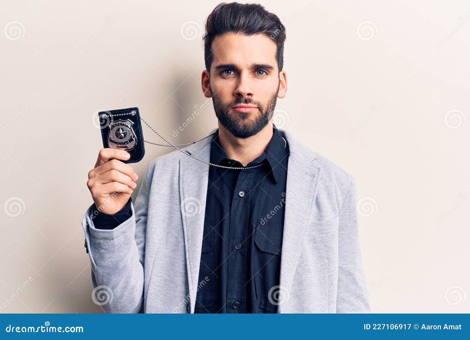 Young Handsome Man with Beard Holding Police Badge Thinking Attitude ...