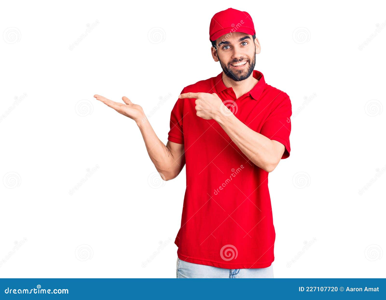 Young Handsome Man With Beard Wearing Delivery Uniform Amazed And