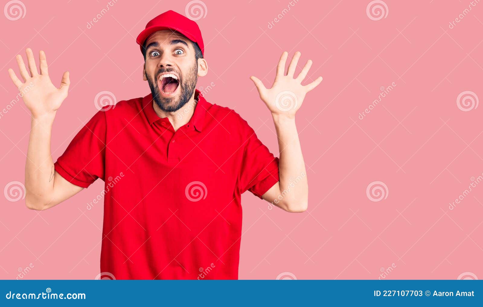 Young Handsome Man With Beard Wearing Delivery Uniform Celebrating