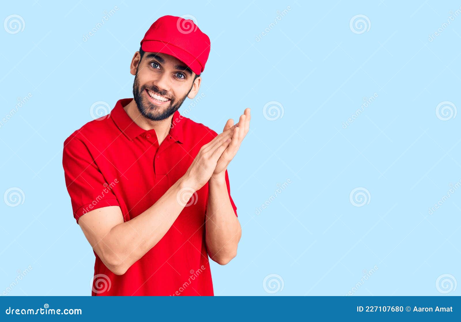 Young Handsome Man With Beard Wearing Delivery Uniform Clapping And