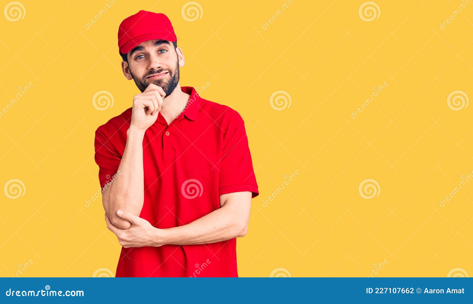 Young Handsome Man With Beard Wearing Delivery Uniform Looking