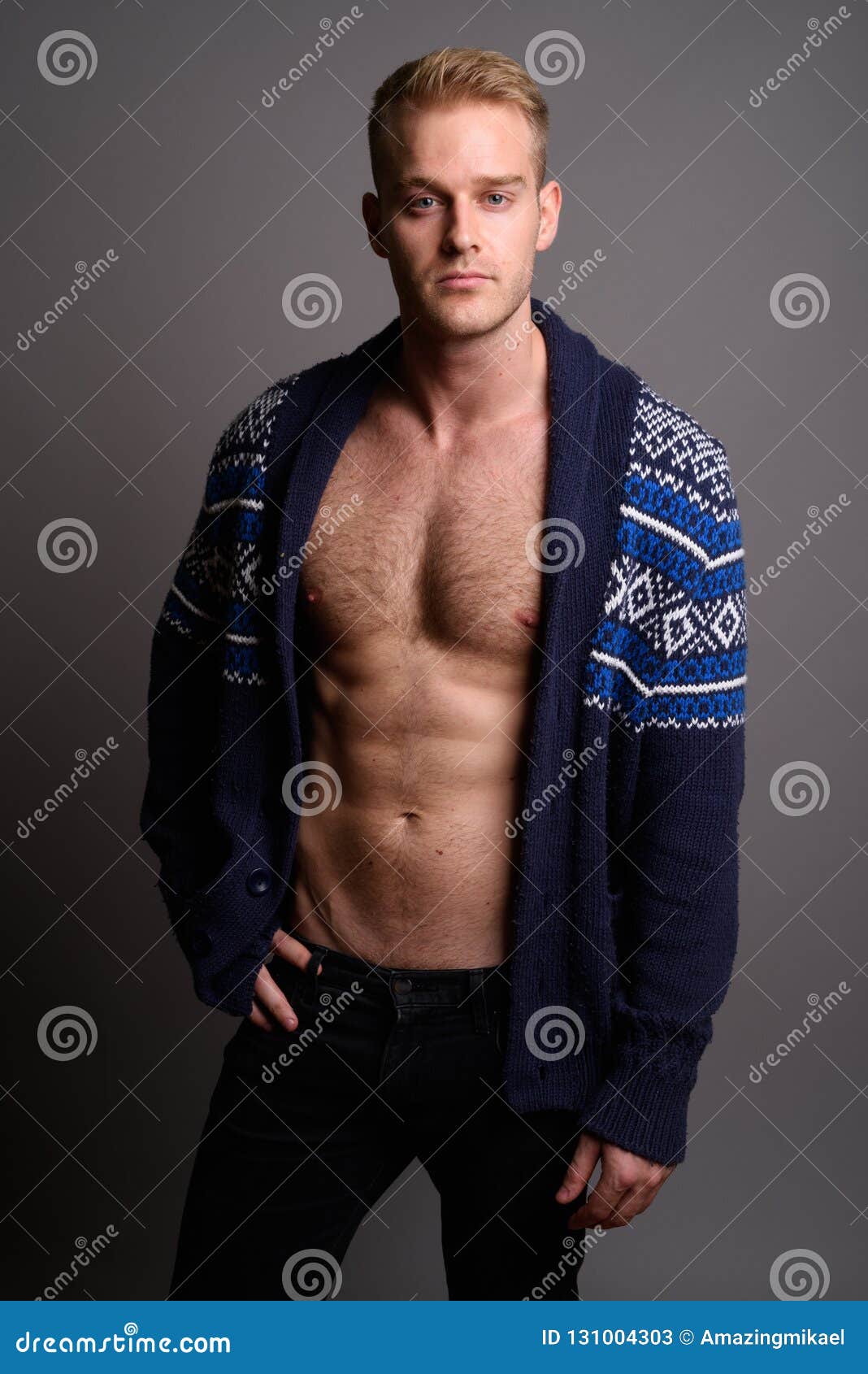 Young Handsome Man With Blond Hair Against Gray Background Stock Image