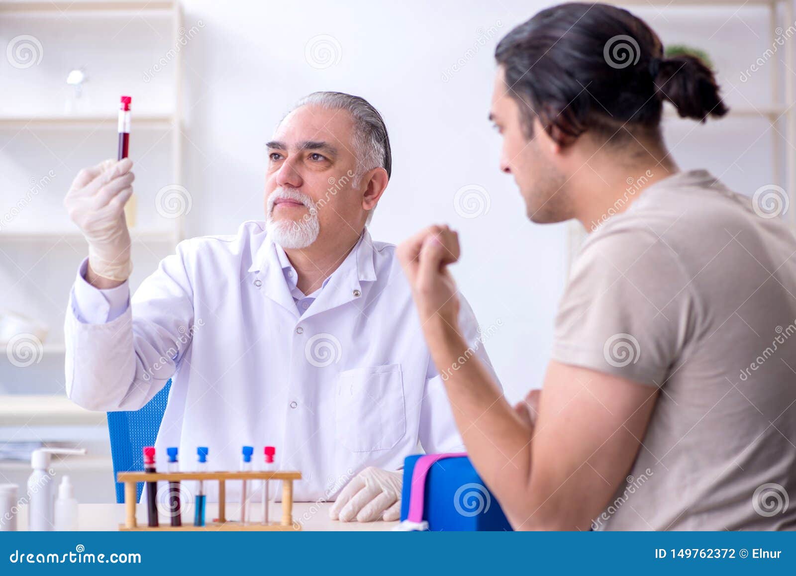 Young Handsome Man during Blood Test Sampling Procedure Stock Photo ...