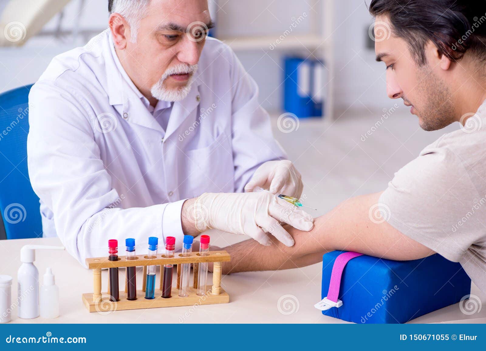 The Young Handsome Man during Blood Test Sampling Procedure Stock Image ...