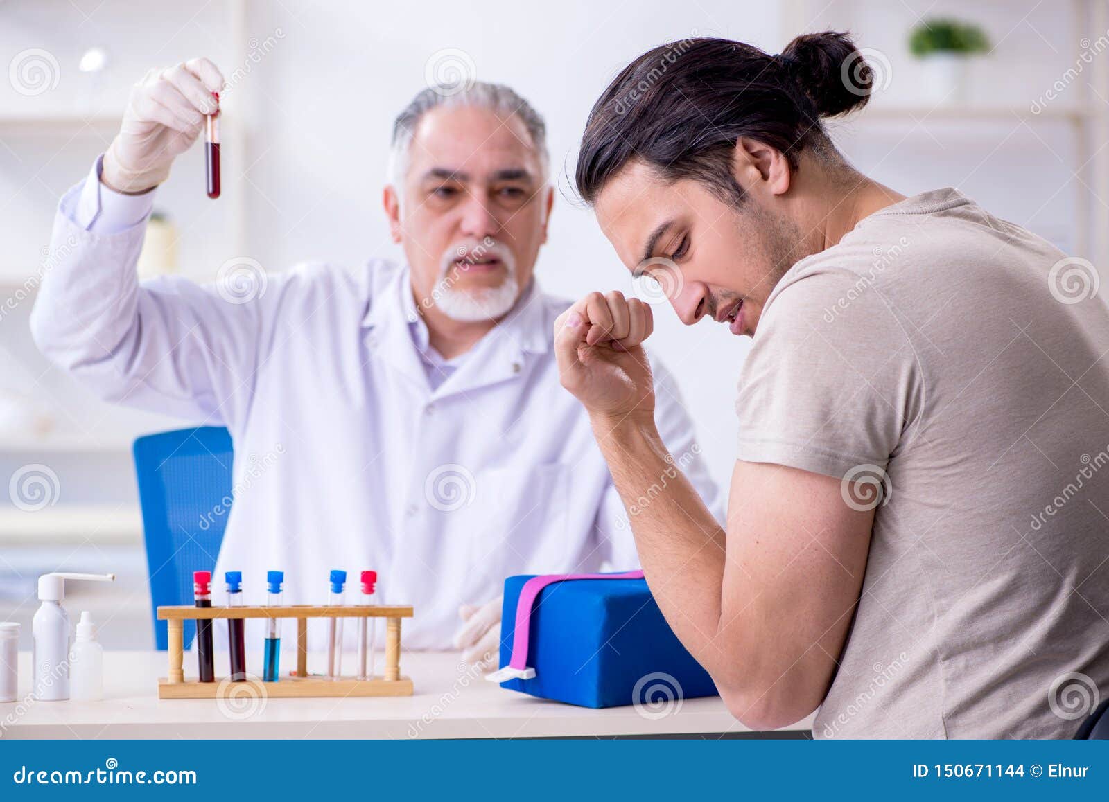 The Young Handsome Man during Blood Test Sampling Procedure Stock Photo ...