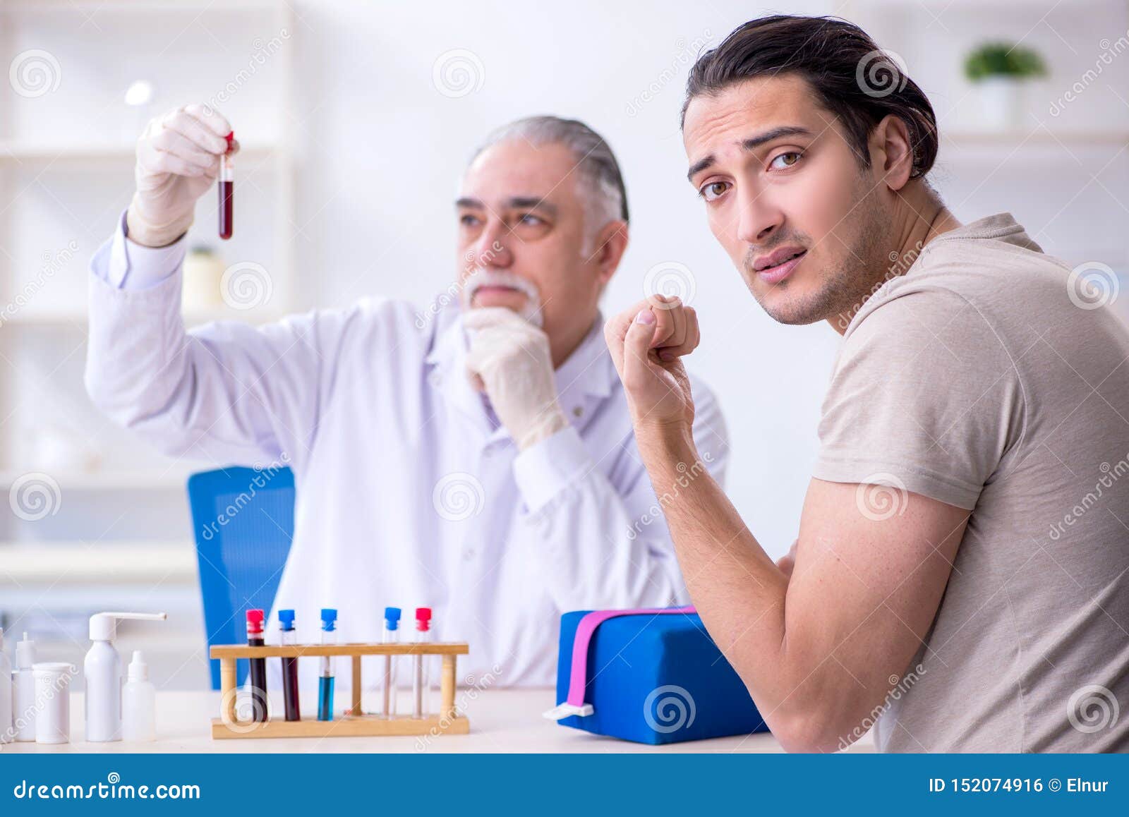 Young Handsome Man during Blood Test Sampling Procedure Stock Photo ...
