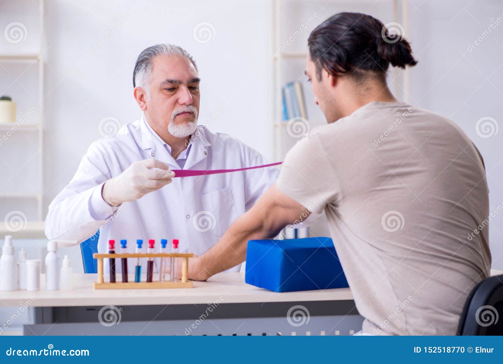 Young Handsome Man during Blood Test Sampling Procedure Stock Photo ...