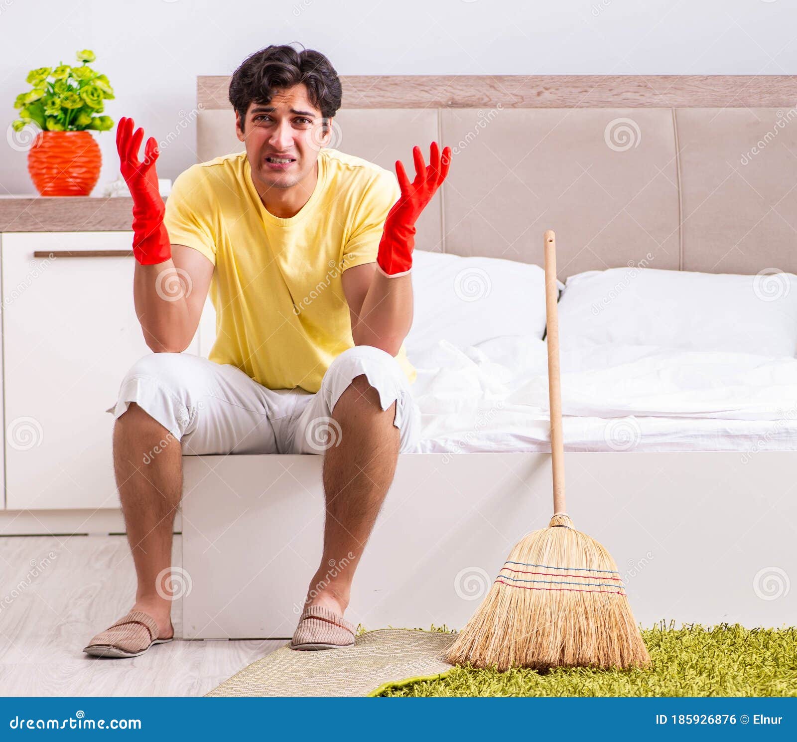 Young Handsome Man Cleaning in the Bedroom Stock Photo - Image of ...