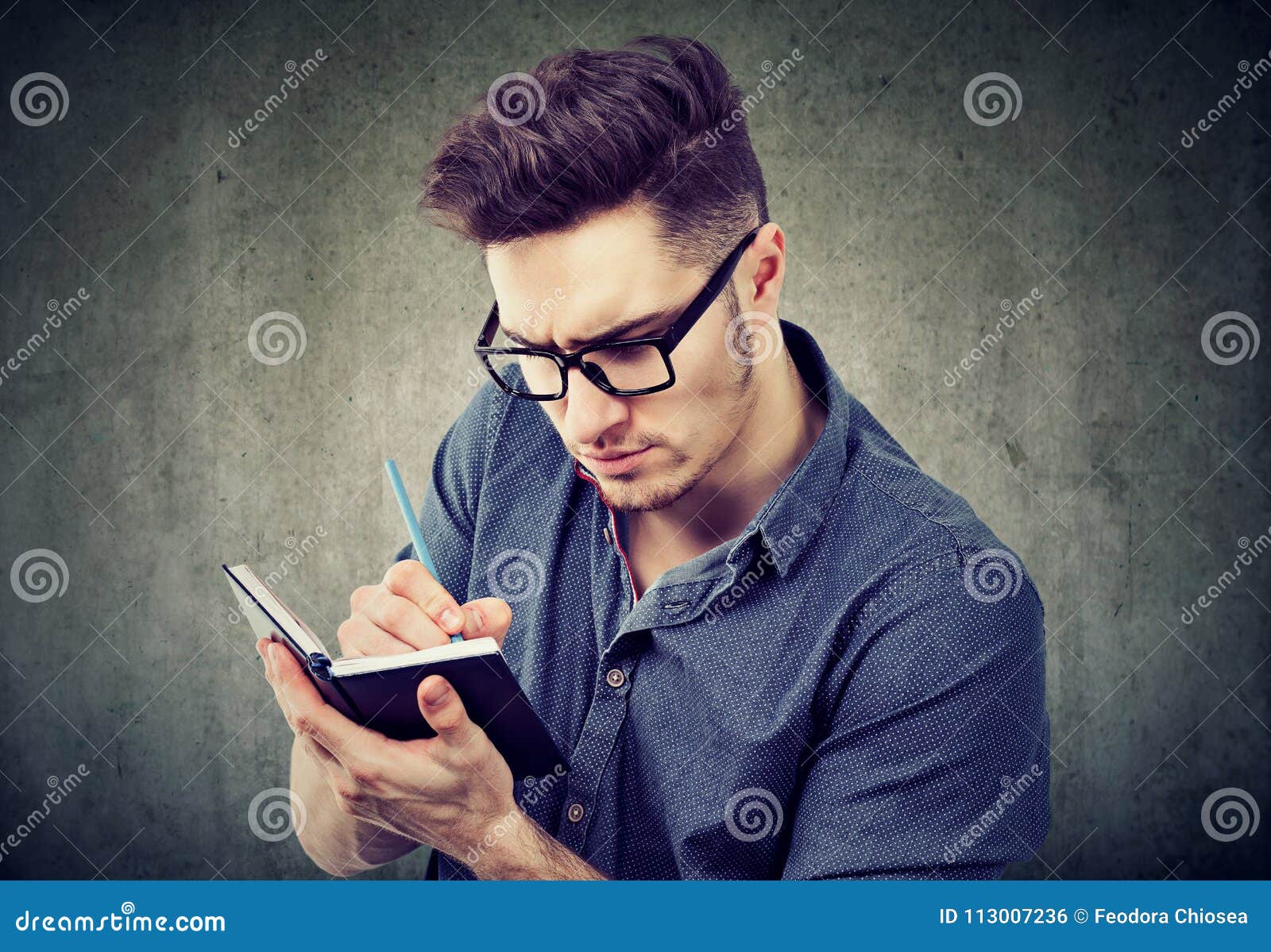 Serious Man Taking Notes with Concentration Stock Photo - Image of ...