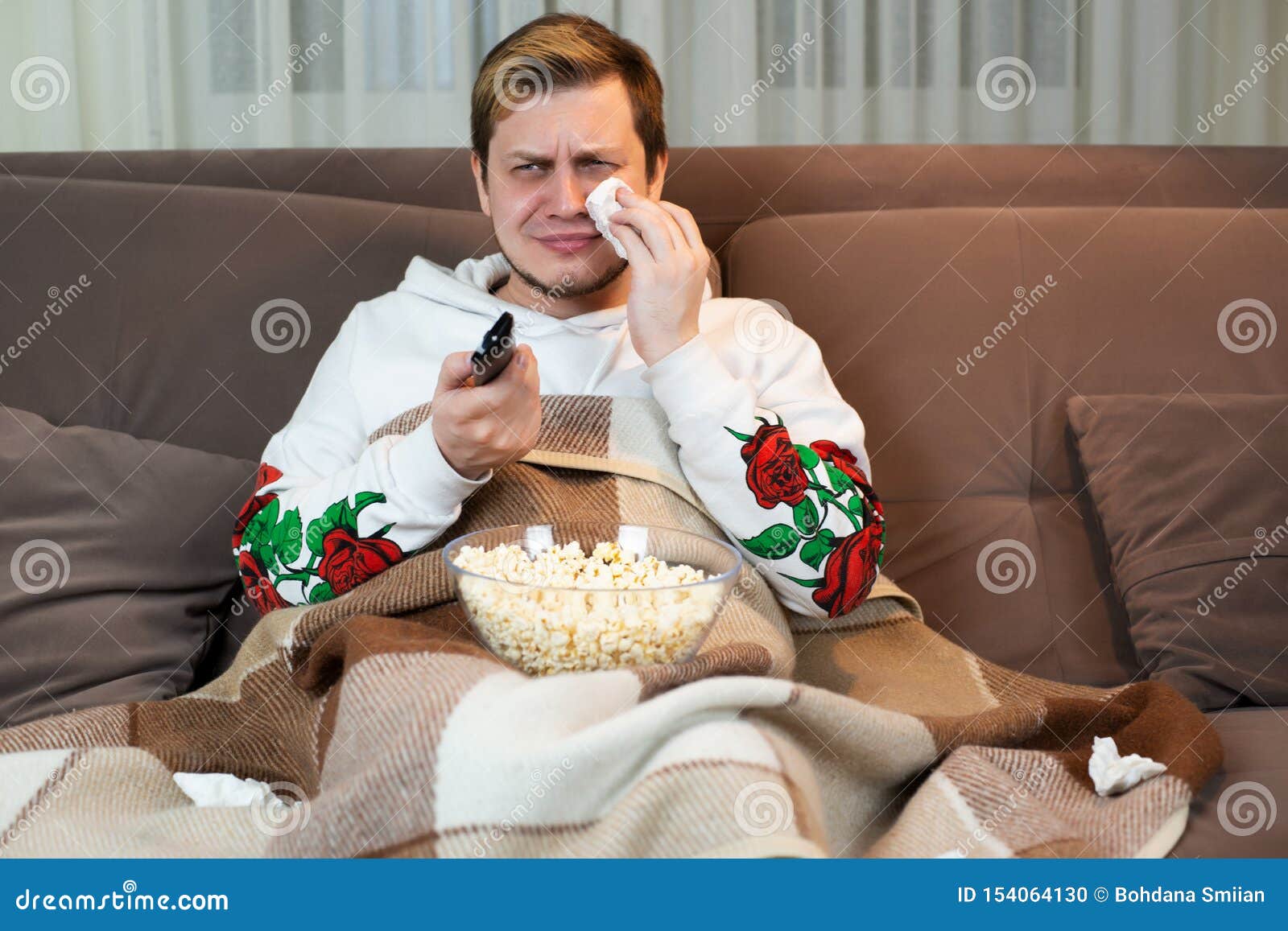 Young Handsome Man Crying while Watching Touching Movie with Popcorn on ...