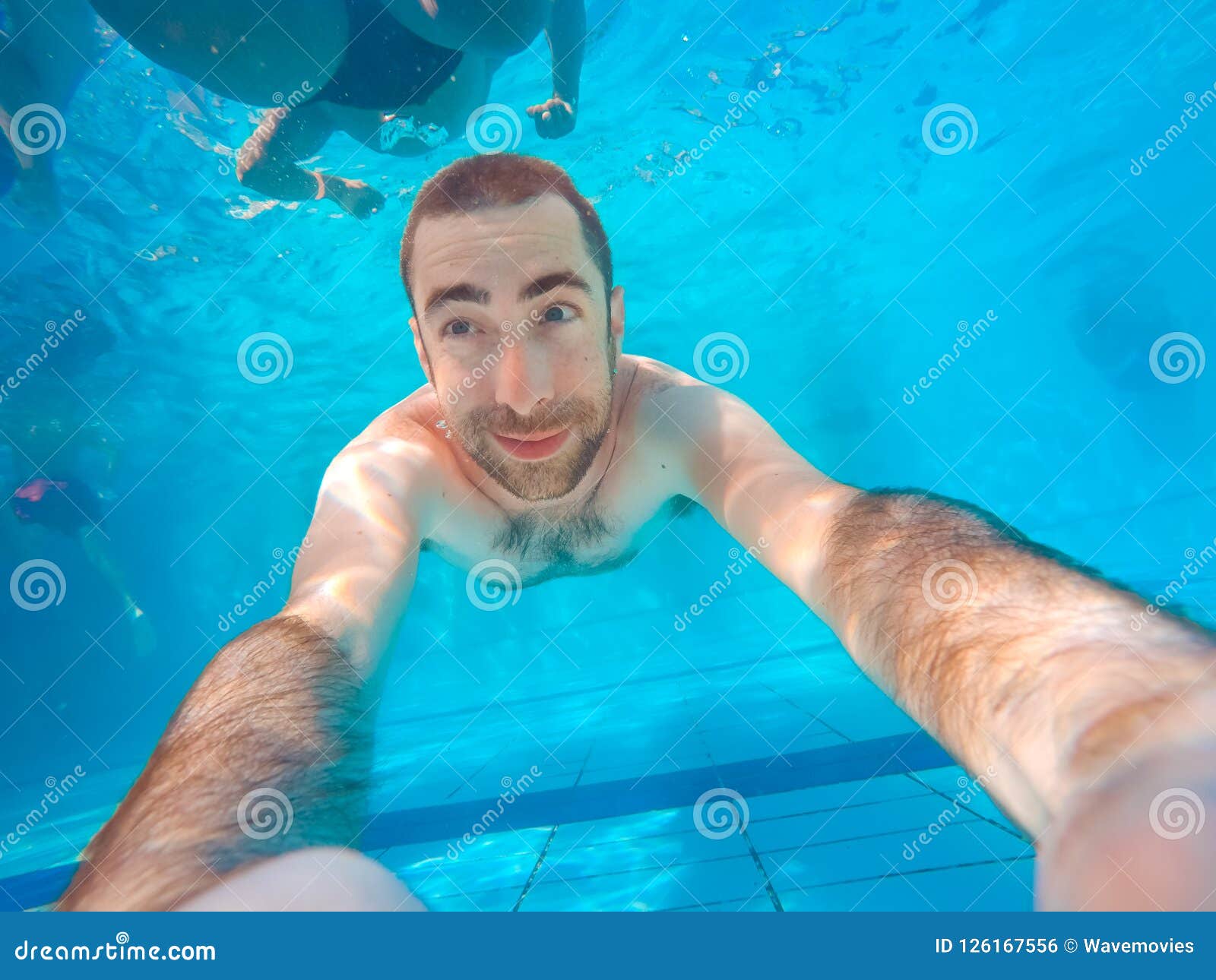 Young Handsome Man Diving Underwater in a Swimming Pool Stock Photo ...