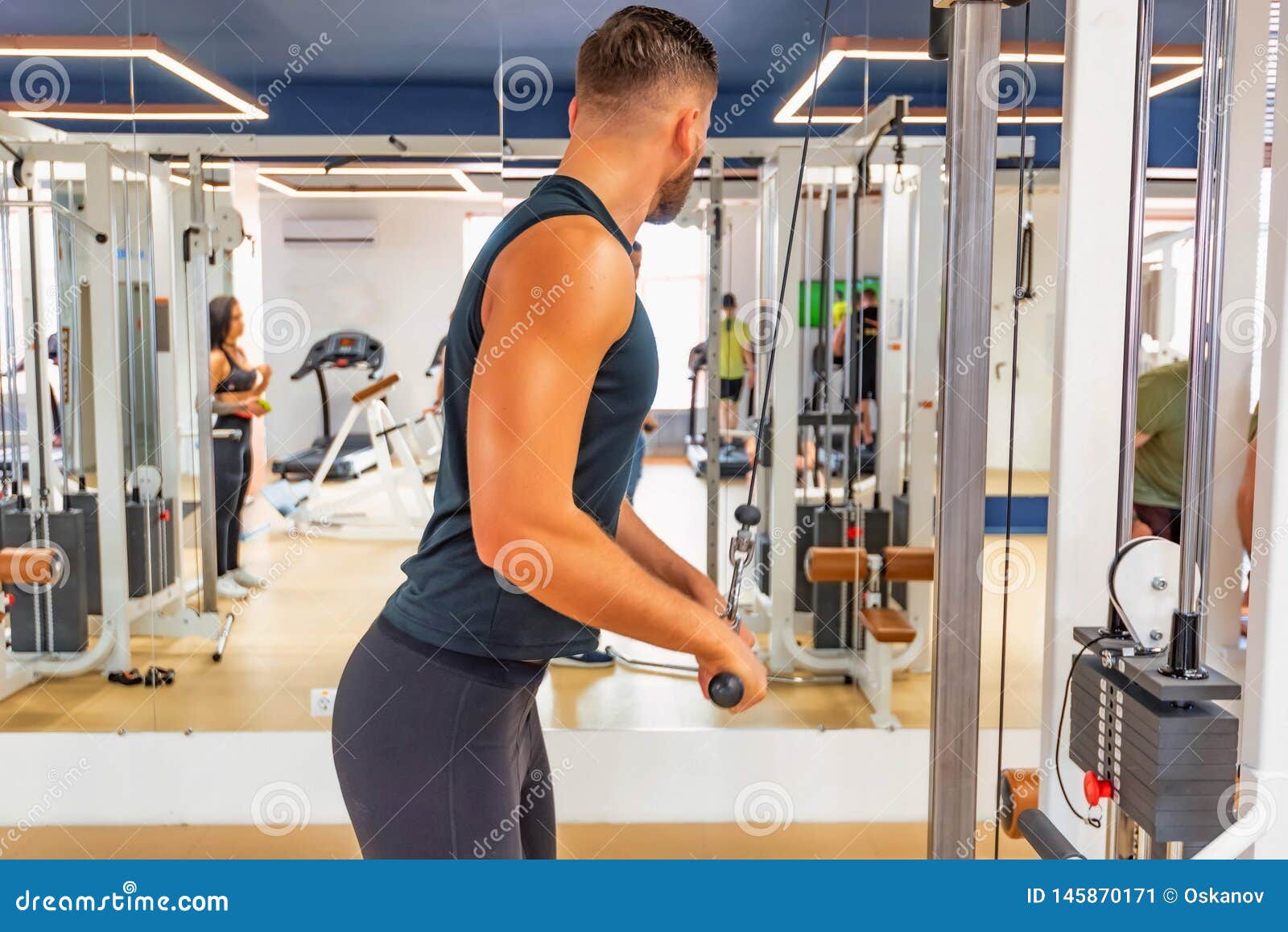 Young Handsome Man Does Lat Pull Down Exercise in Gym Stock Image ...