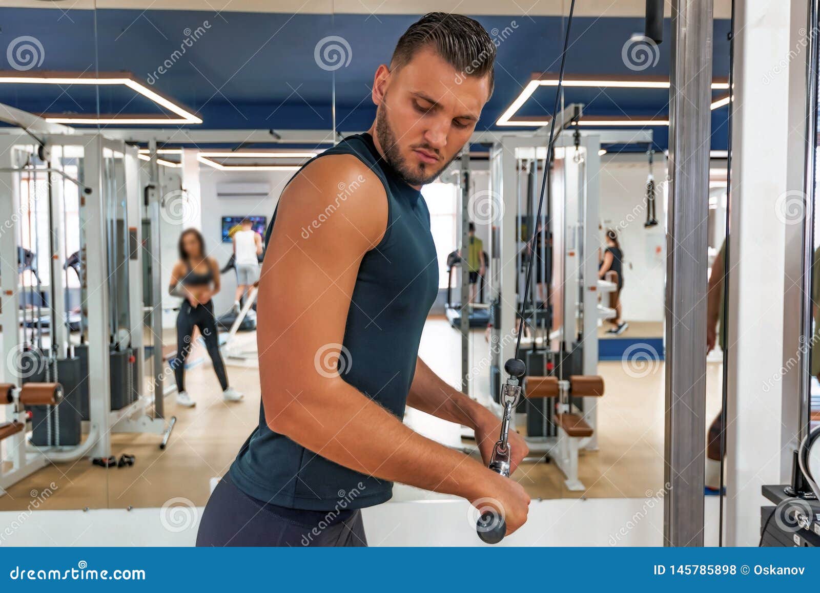 Young Handsome Man Does Lat Pull Up Exercise in Gym Stock Photo - Image ...