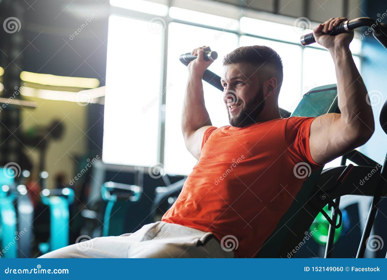 Young Handsome Man Doing Exercises in Gym Stock Photo - Image of ...