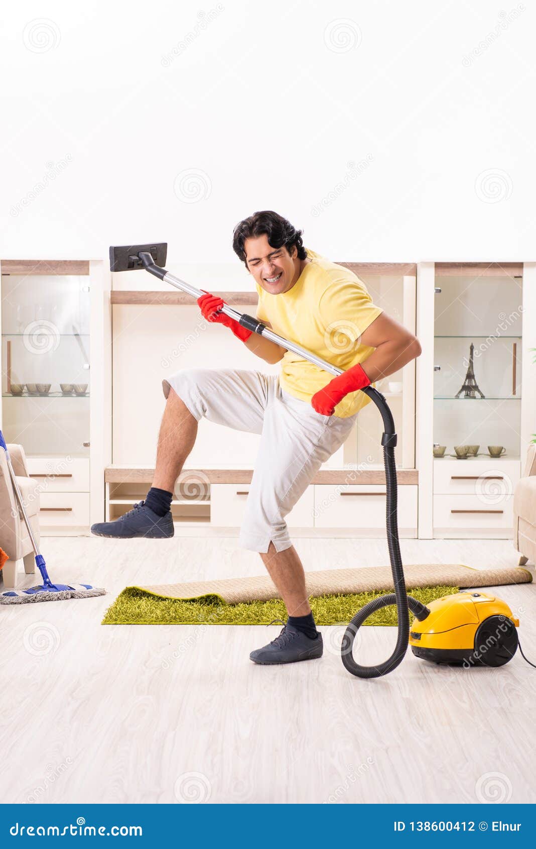 The Young Handsome Man Doing Housework Stock Photo - Image of dust ...