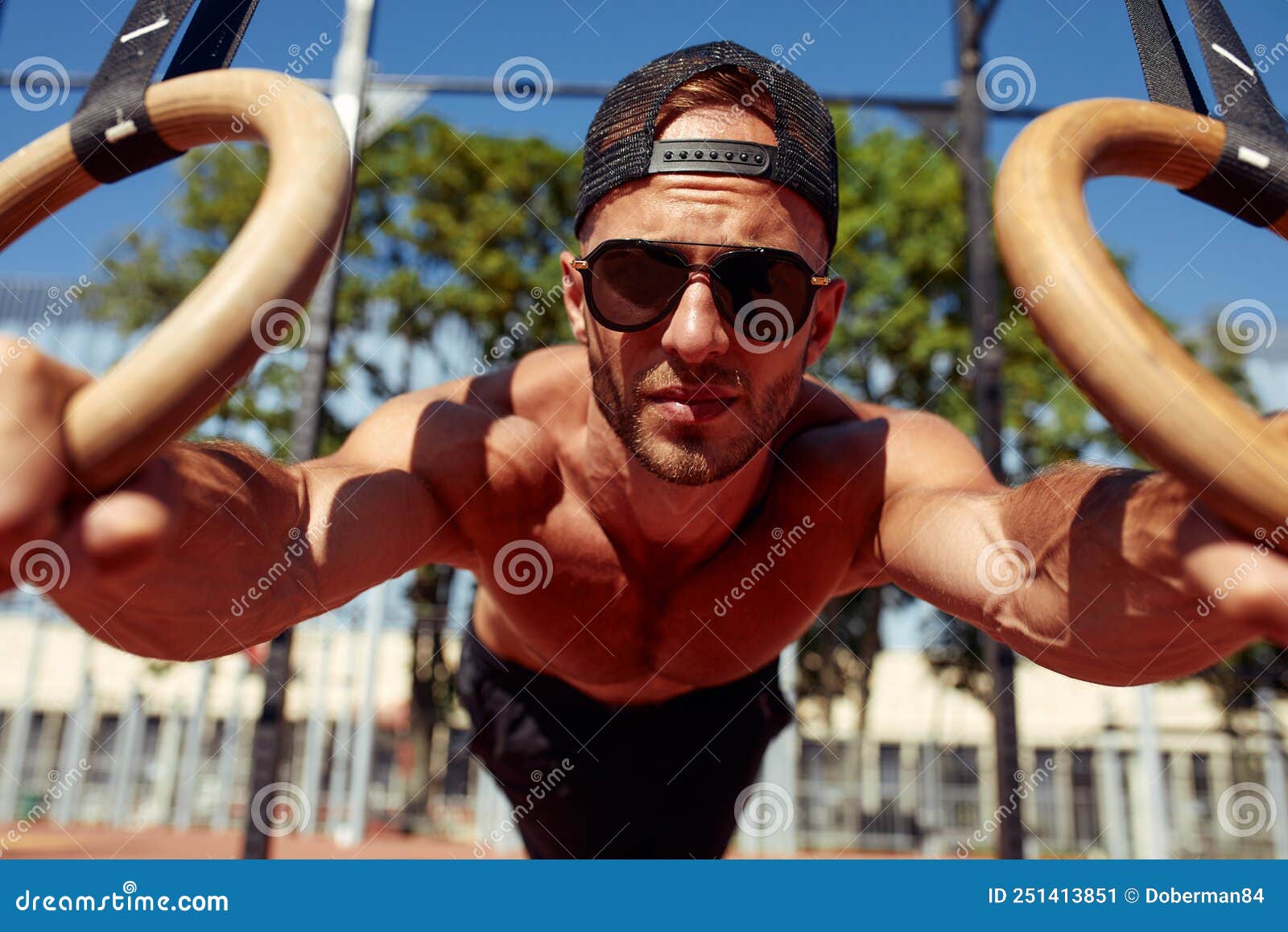 Young and Handsome Man is Doing Some Push-ups. he is Using Loops for ...