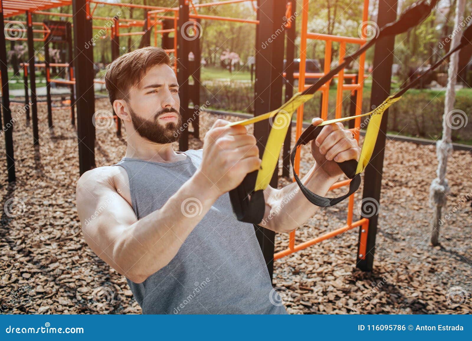 Young and Handsome Man is Doing Some Push-ups. he is Using Loops for ...