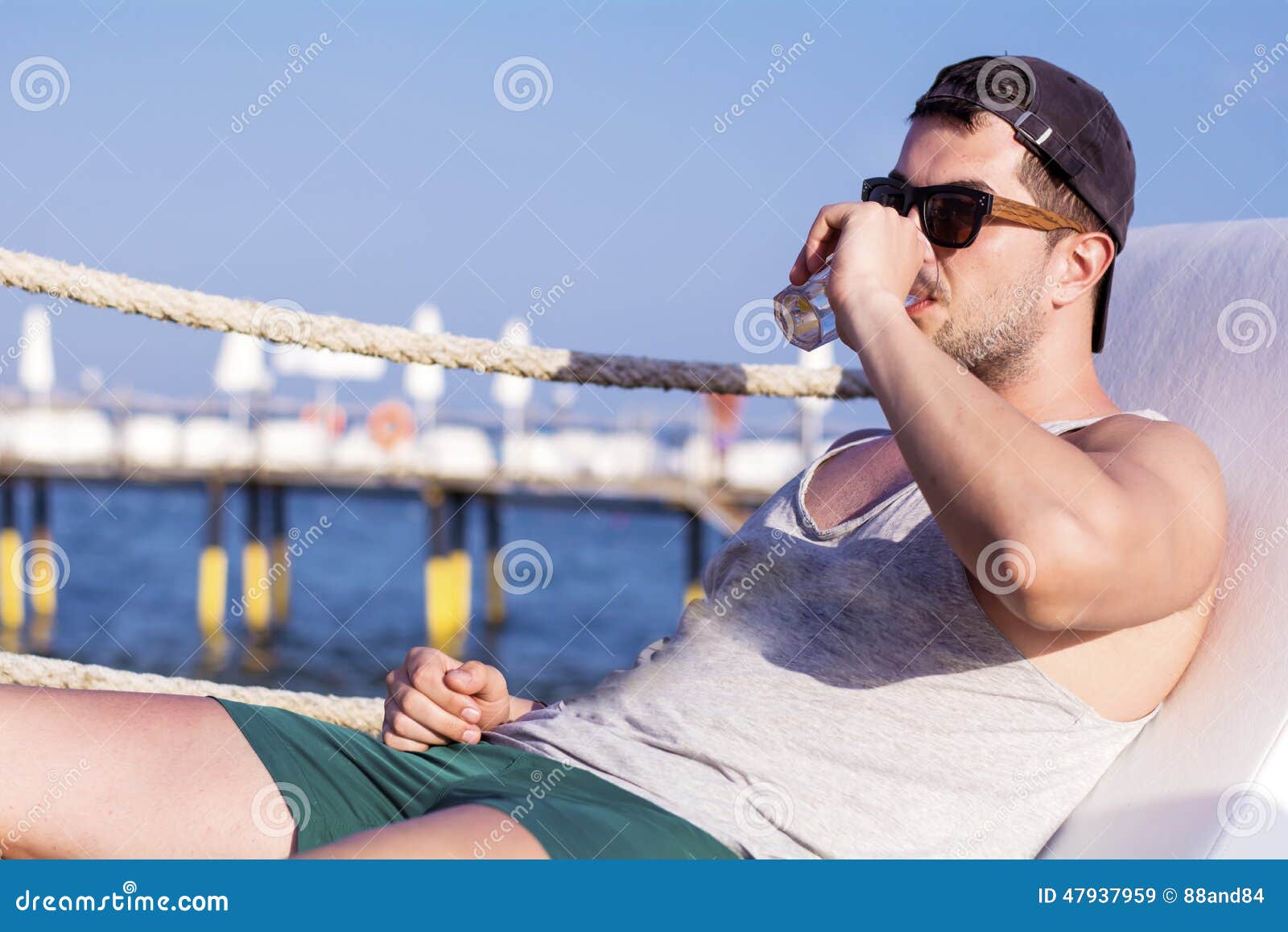 Young Handsome Man Drinking Cocktail on the Beach Stock Image - Image ...
