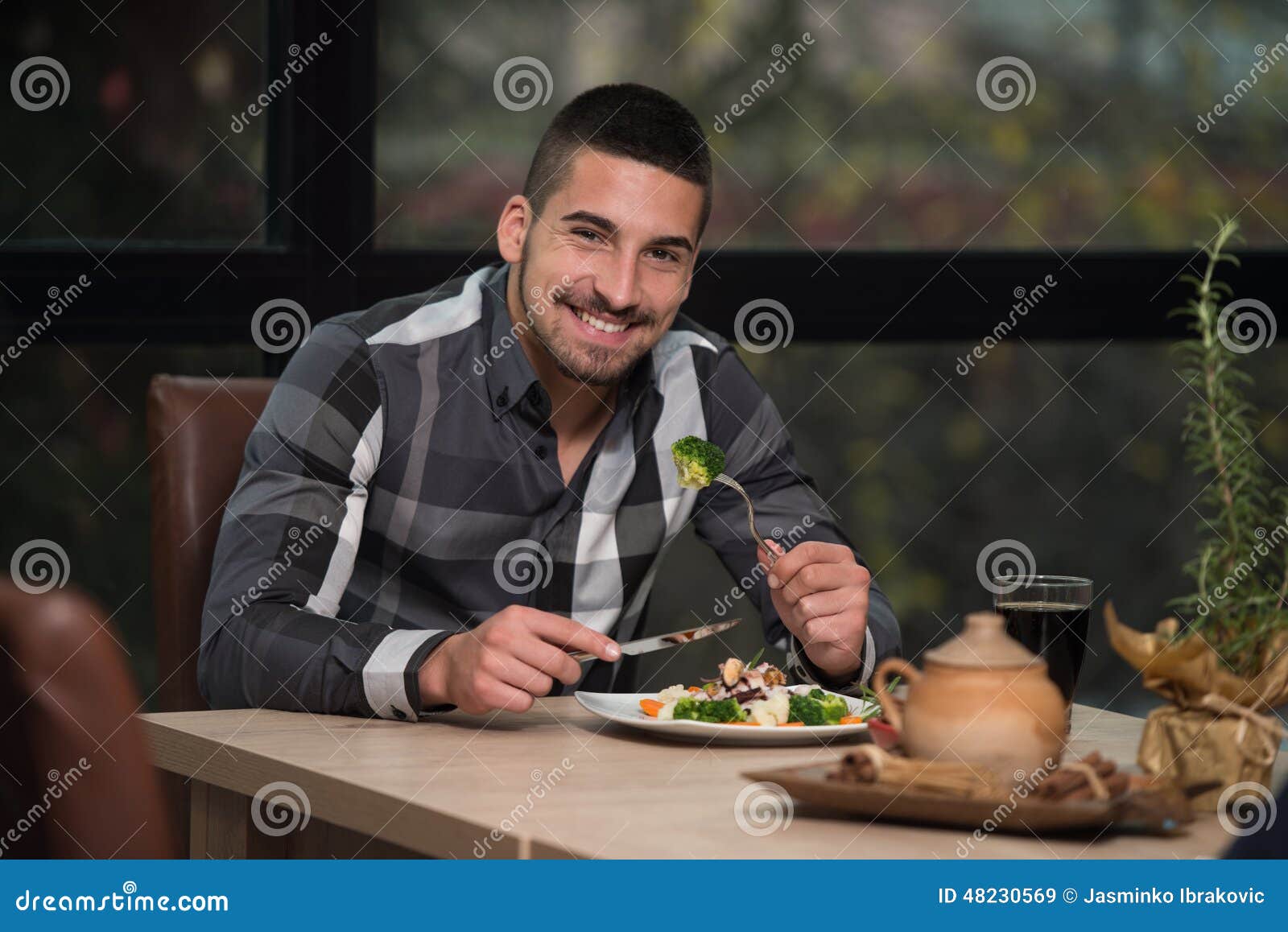 Young Handsome Man Eating at a Restaurant Stock Image - Image of beauty ...