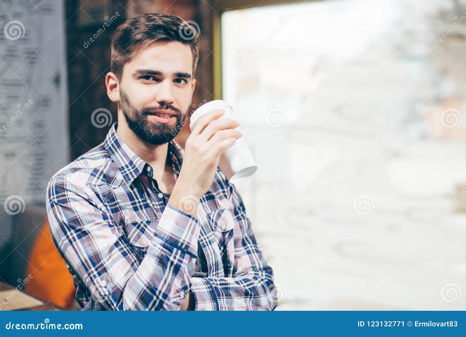Young Handsome Man Enjoying Coffee in a Cafe. Stock Image - Image of ...