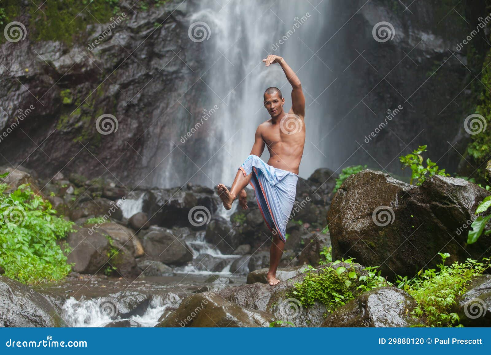 Handsome man at waterfall stock photo. Image of bali - 29880120
