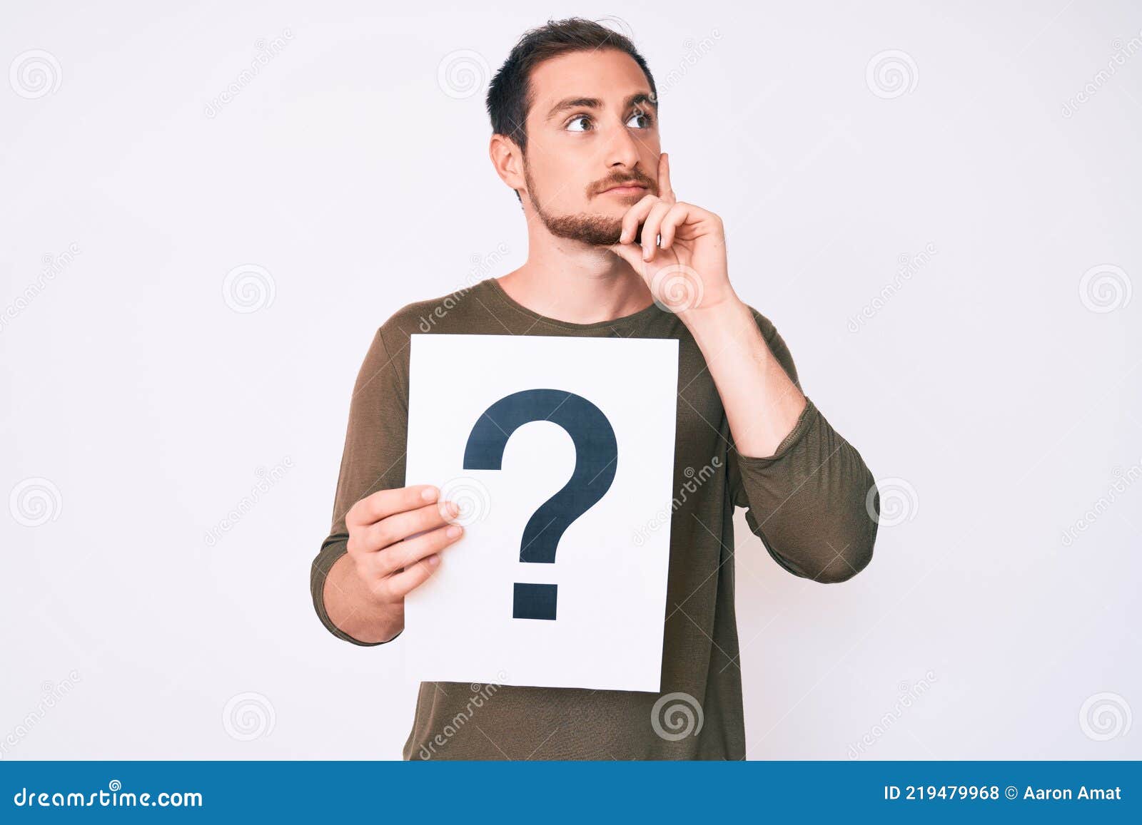 Young Handsome Man Holding Question Mark Serious Face Thinking about ...
